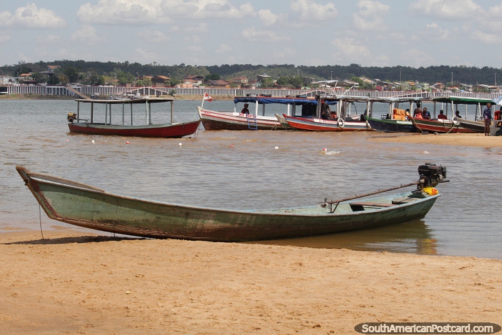 Passenger boats lined up and ready to take people back to the mainland ...
