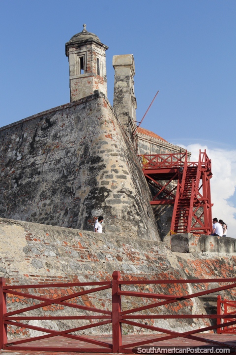 Red stairs up to the towers at Castle San Felipe in Cartagena, a stone ...