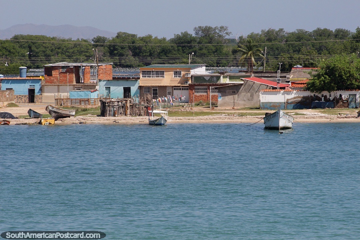 Houses and boats on the shore of Margarita Island in Punta de Piedras ...